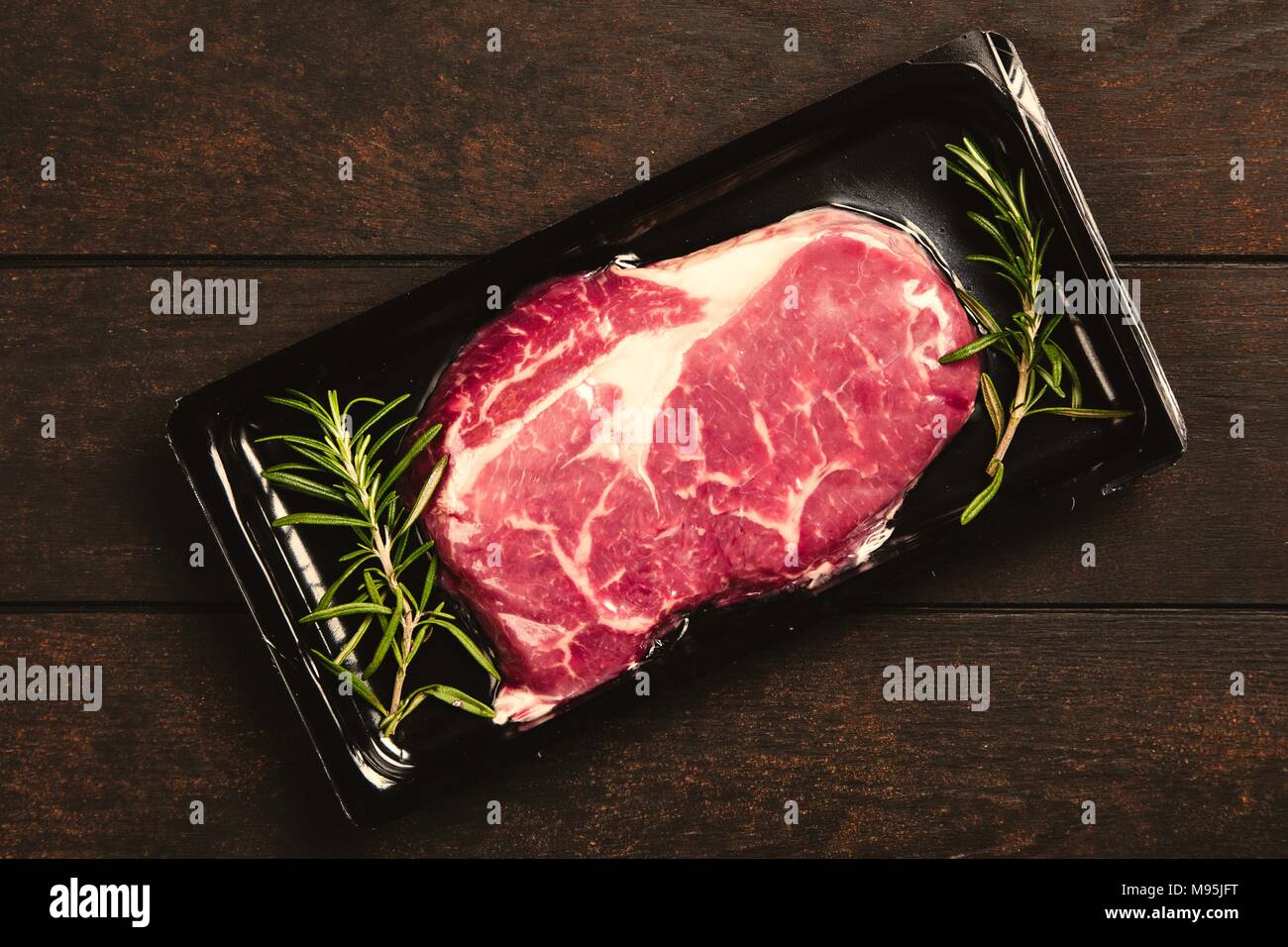 Raw steak in an airtight packaging Stock Photo - Alamy