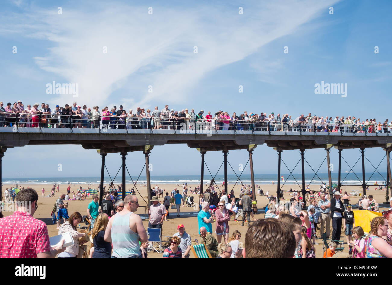 People on Saltburn`s Victorian pier under a blue sky in summer ...