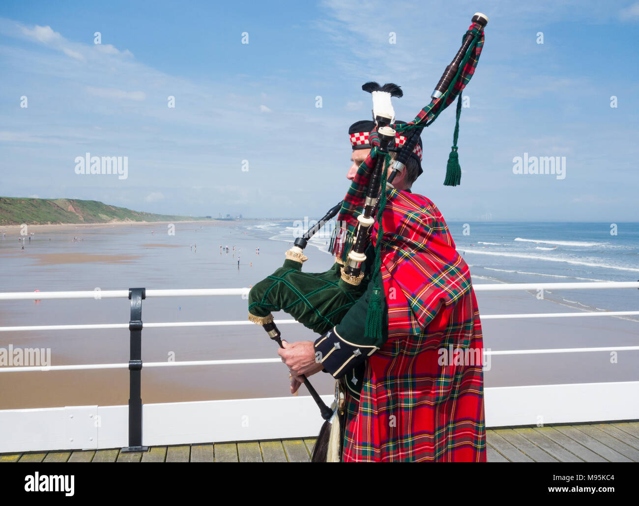 Scottish Piper in traditional dress on Saltburn`s Victorian pier ...