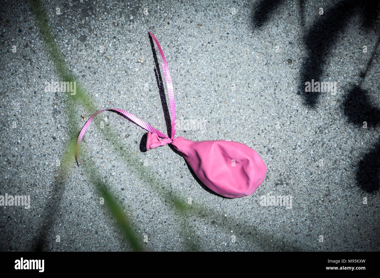 Deflated Pink Balloon Stock Photo - Alamy