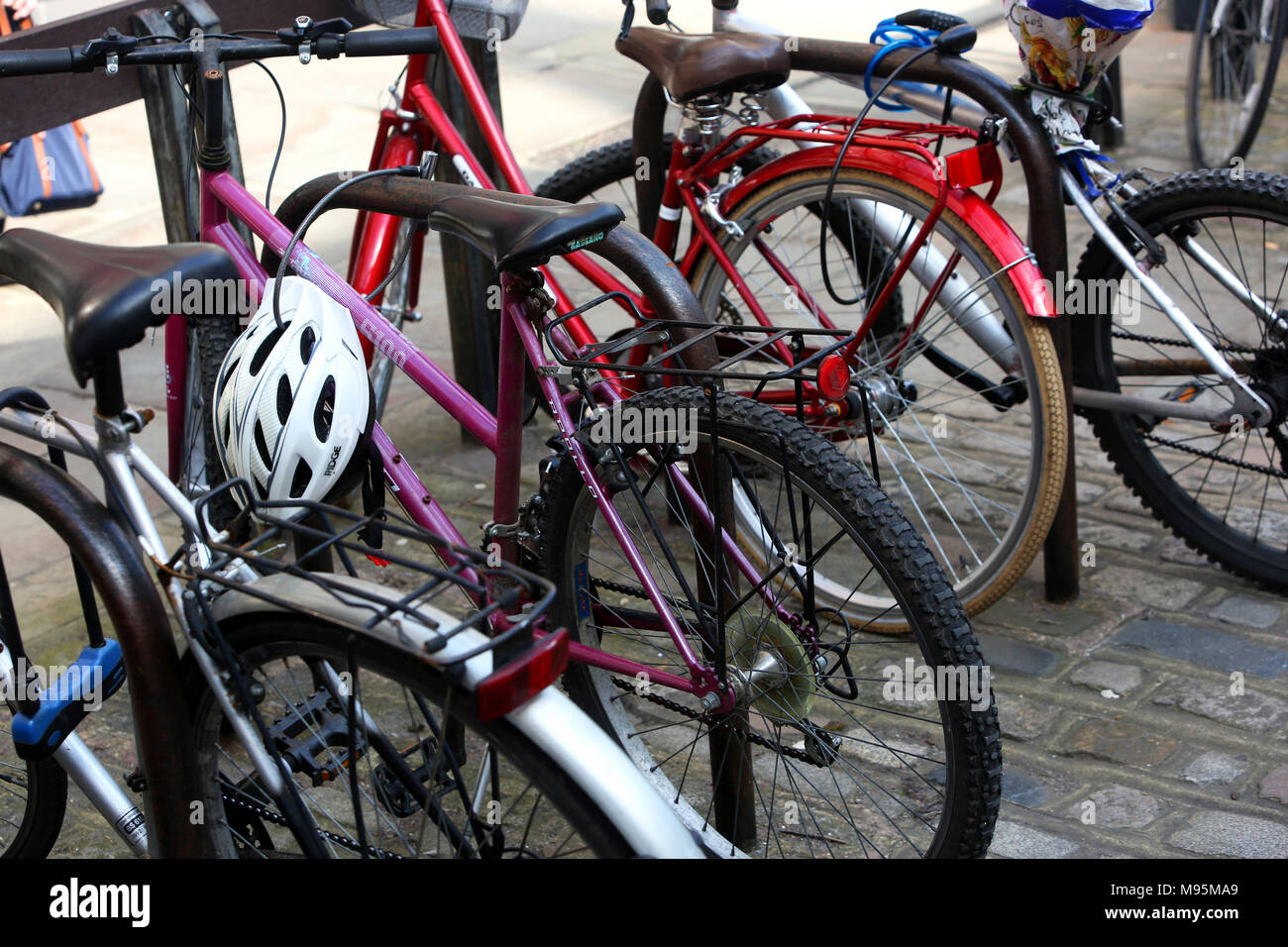 A selection of bikes and bicycles pictured chained up in bike bays in ...