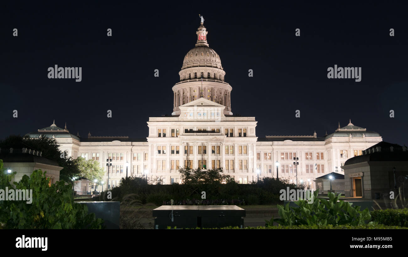 The building architecture stands out from pole lighting beaming onto ...