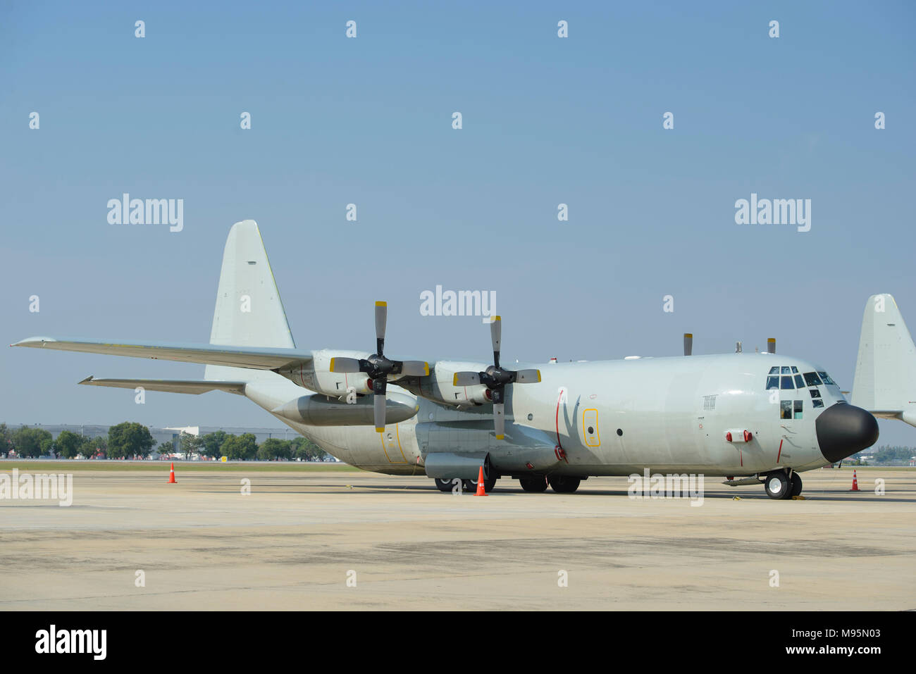 Hercules military transport plane on runway at airport Stock Photo - Alamy