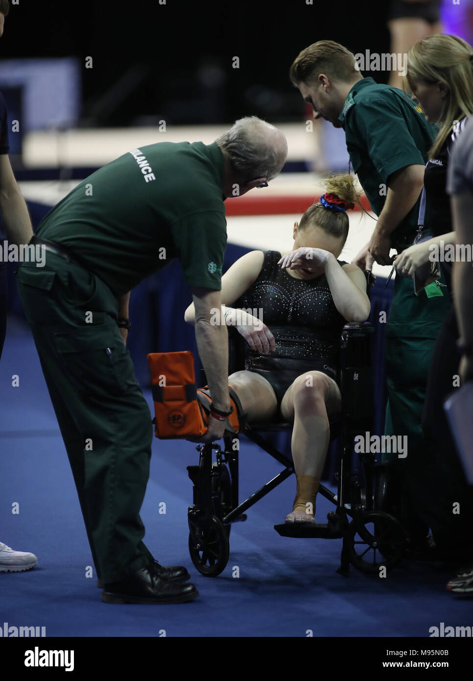 Great Britain's Amy Tinkler is taken away with an injury in practice ...