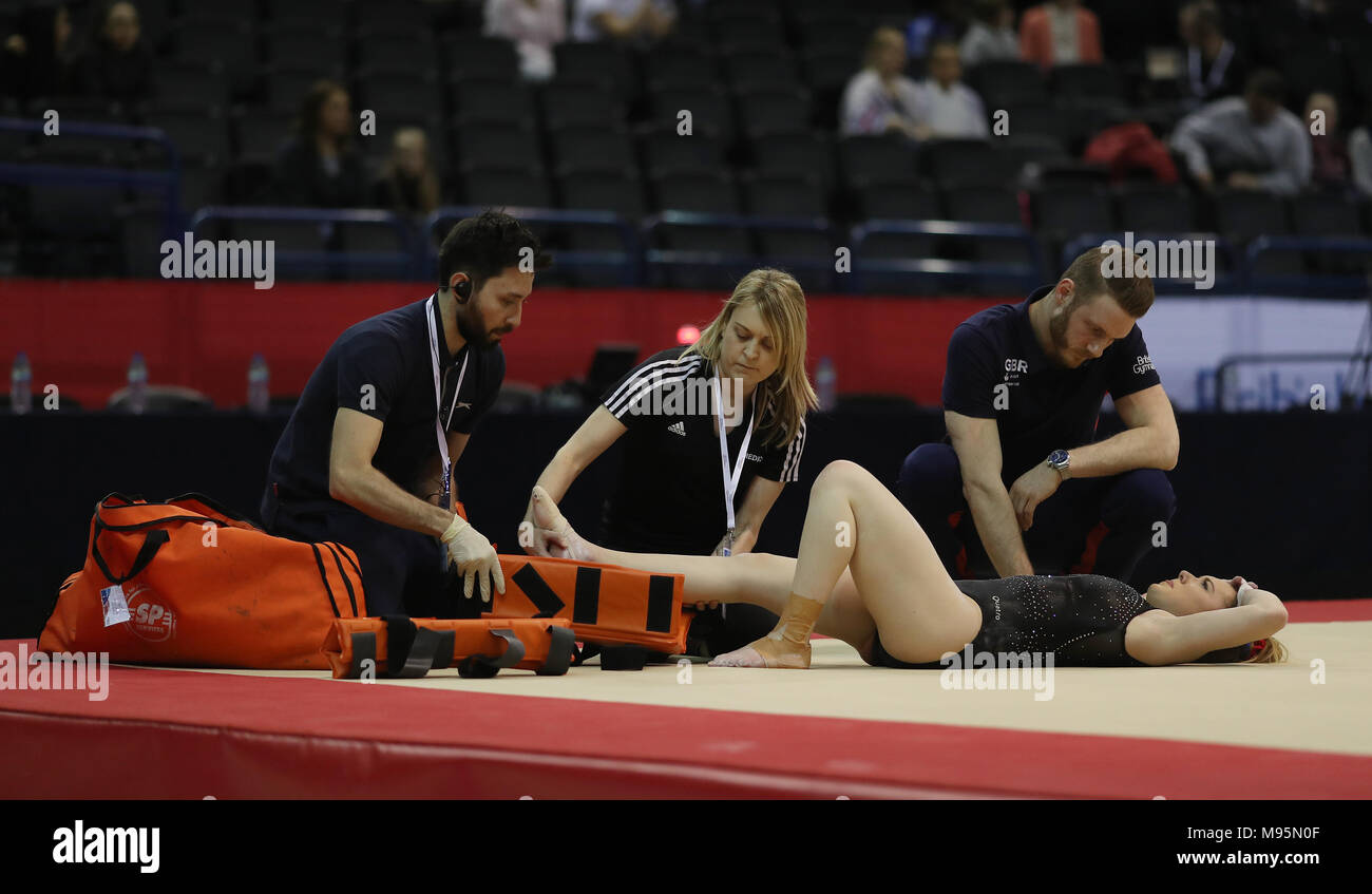 Great Britain's Amy Tinkler is treated for an ankle injury in practice ...