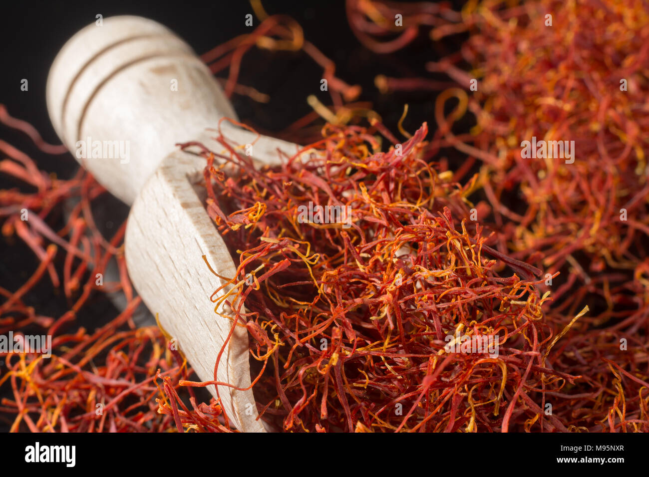 Macro collection, expensive real dried saffron spice close up on black ...