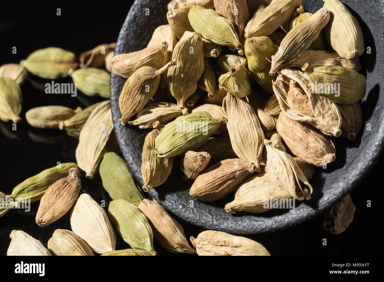 Macro collection, dried green cardamom pods close up on black ...