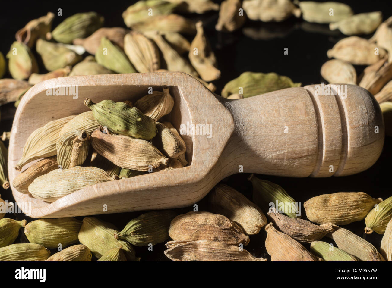 Macro collection, dried green cardamom pods close up on black ...