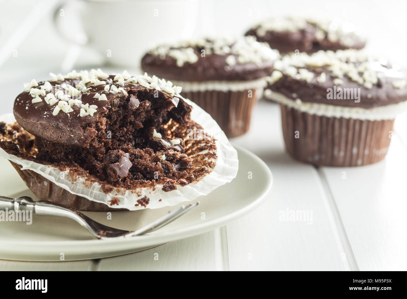 Tasty chocolate muffins. A broken muffin Stock Photo - Alamy