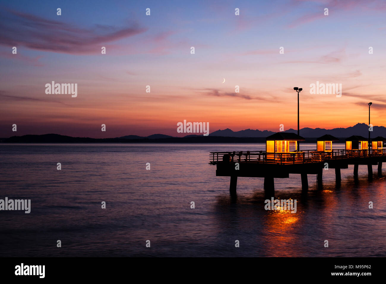 Fishing Pier on Elliott Bay with crescent moon and Olympic Mountains ...