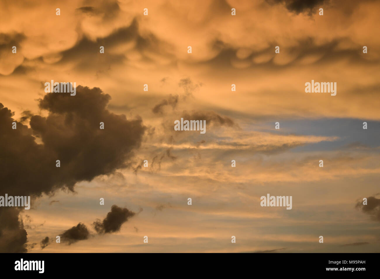 The sky lit up with the setting sun Stock Photo - Alamy