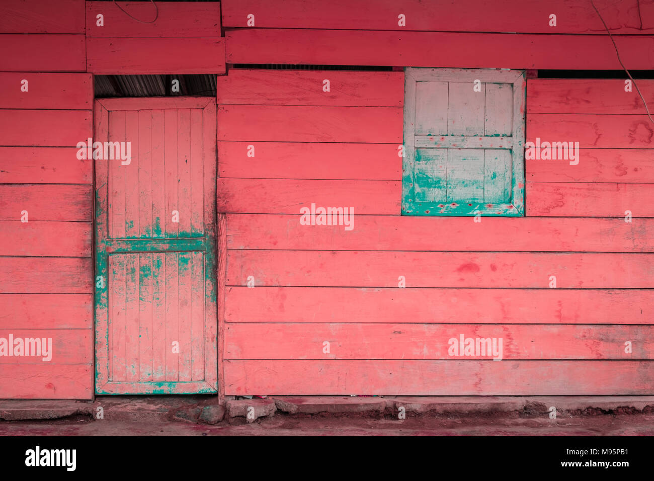 front of old wooden house - pink, vintage wooden hut Stock Photo - Alamy