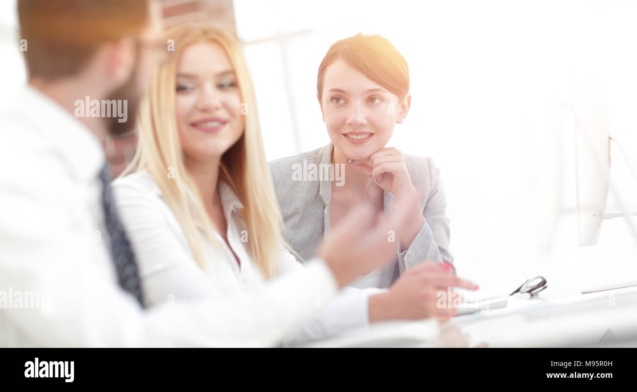 background image of a business team at a Desk Stock Photo - Alamy
