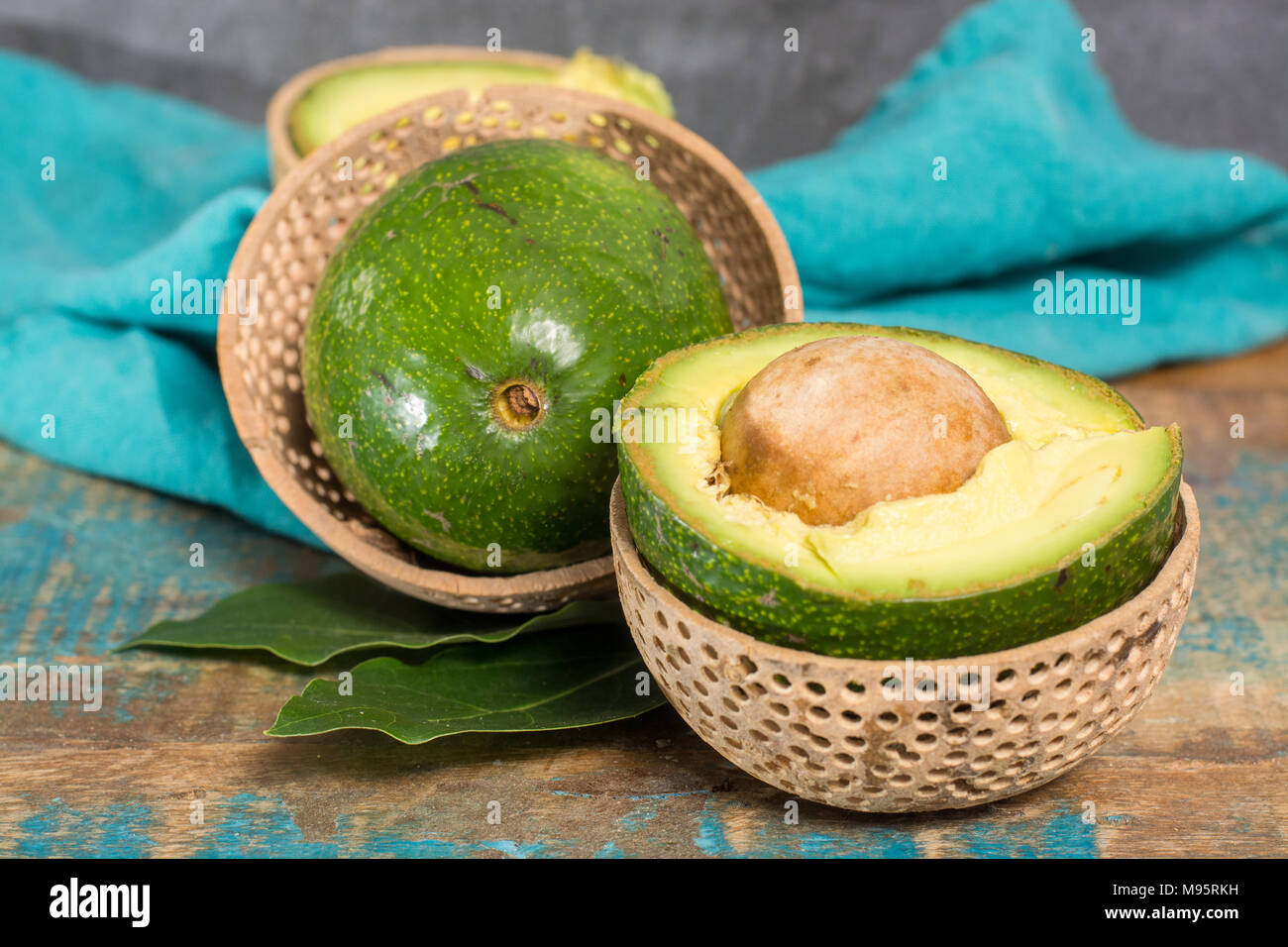 Green ripe tasty Ryan avocado with big round seed, ready to eat on ...