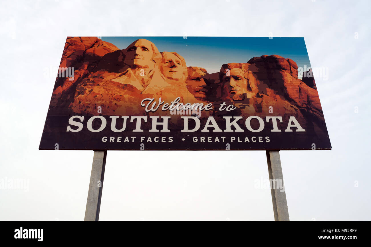 Colorful highway sign letting drivers know the South Dakota boundary ...