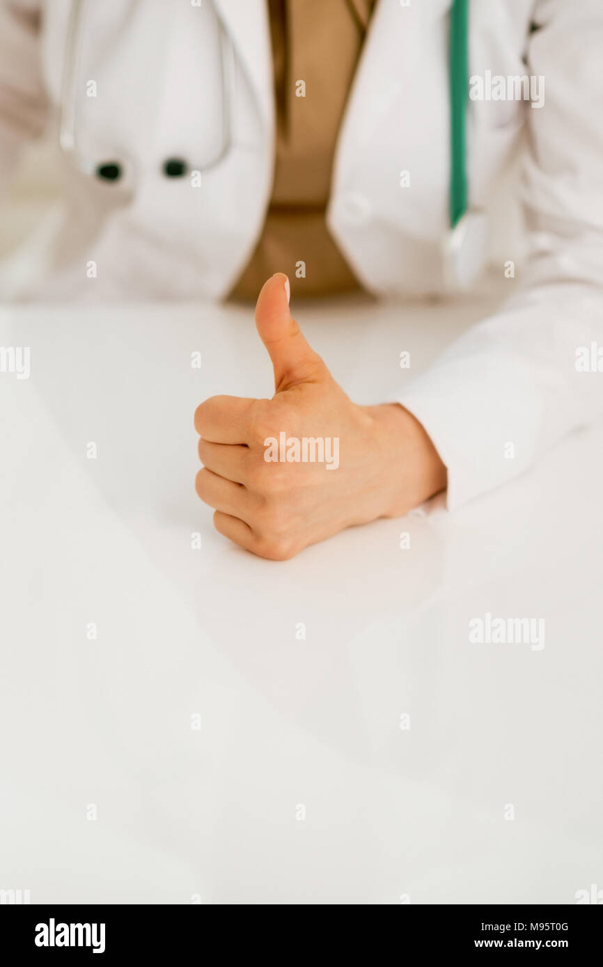 Closeup on medical doctor woman showing thumbs up Stock Photo - Alamy