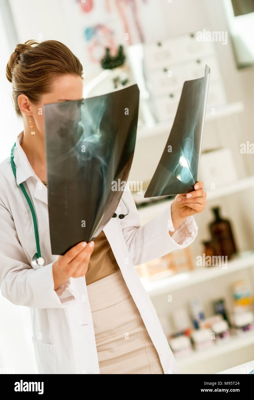 Medical doctor woman looking on fluorography in office Stock Photo - Alamy