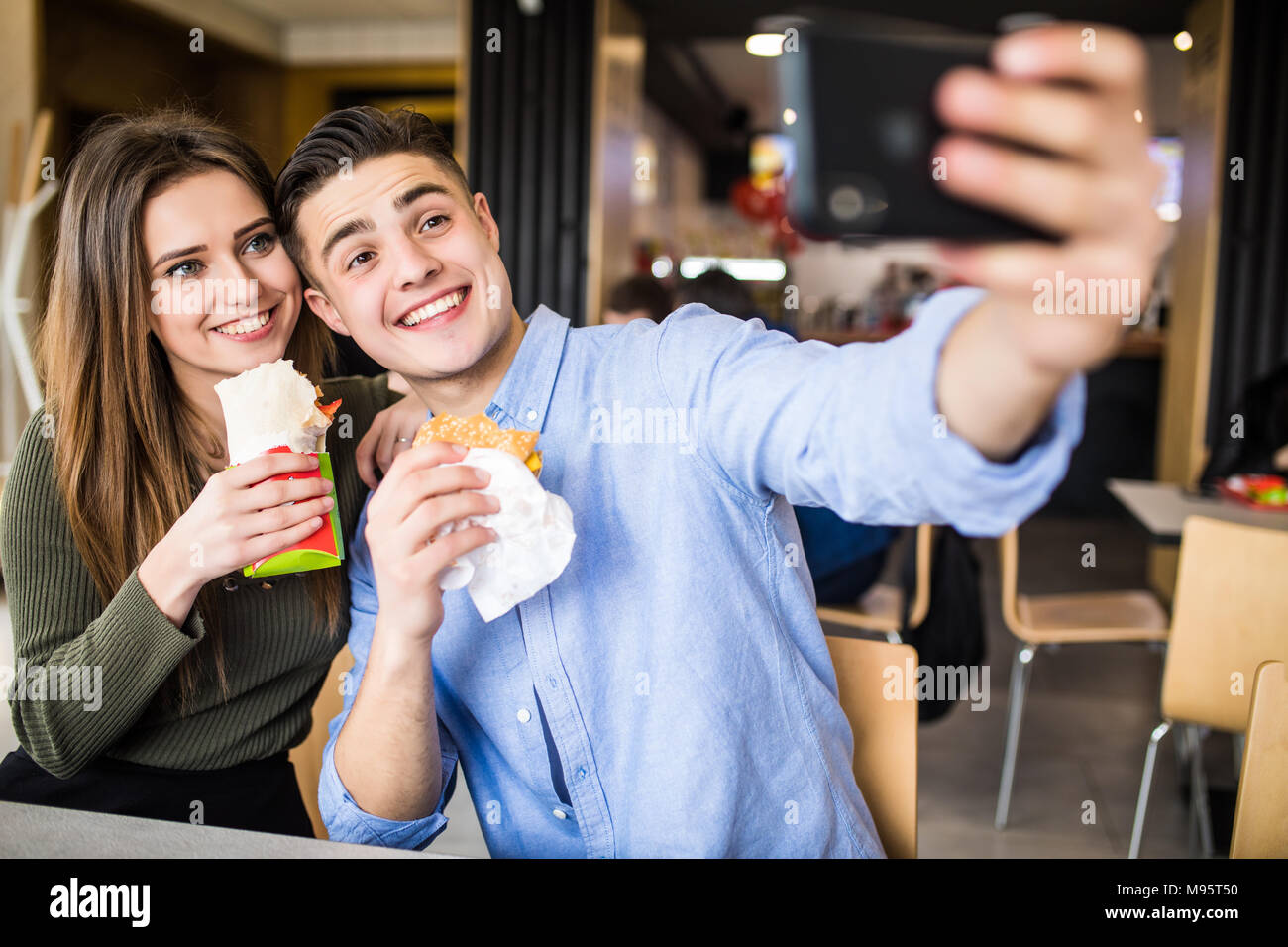 Eating burger hi-res stock photography and images - Alamy