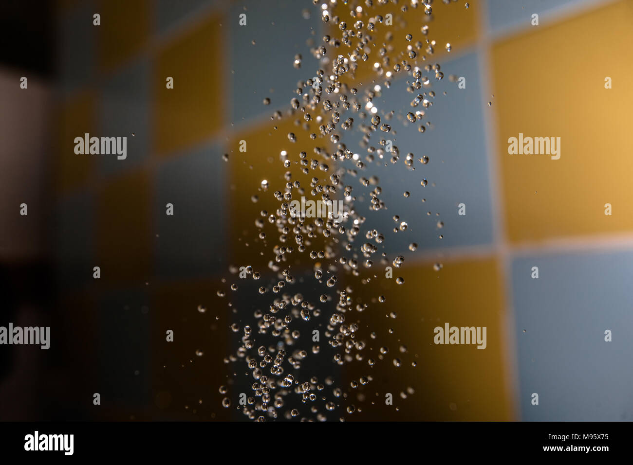Water droplets fall from a shower tap Stock Photo - Alamy