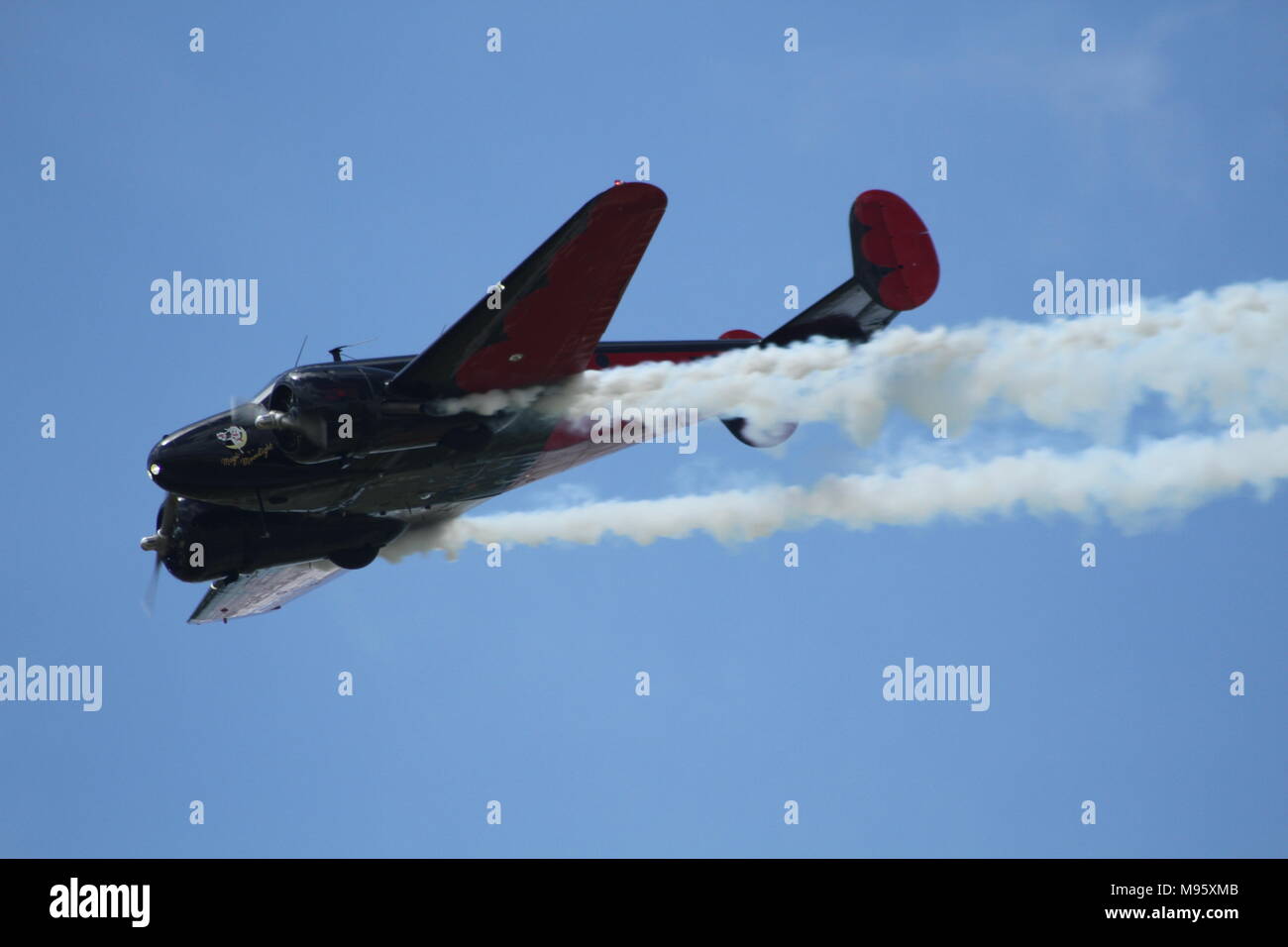 Beechcraft Model 18 performing an aerobatic show at an airshow Stock ...