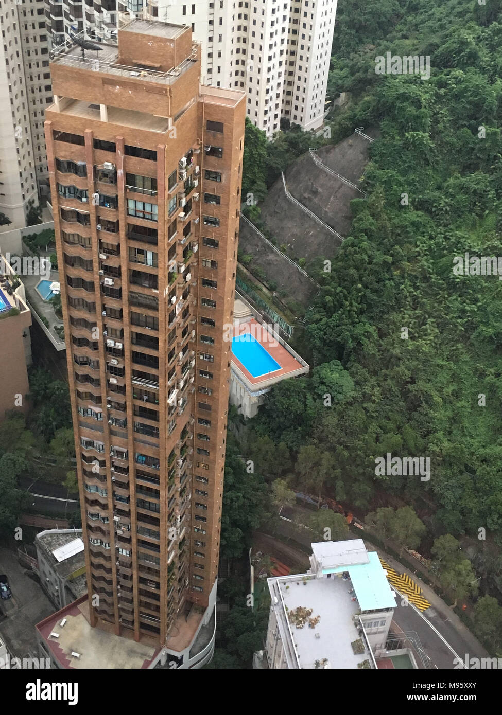 Photo of a tower building in the city of Hong Kong in Asia. It's ...