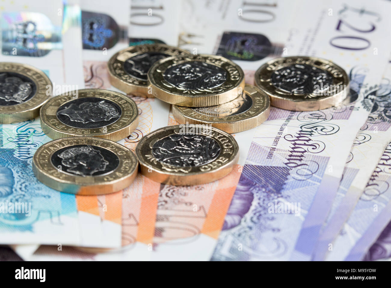 New pound coins and notes of currency of Great Britain Stock Photo - Alamy