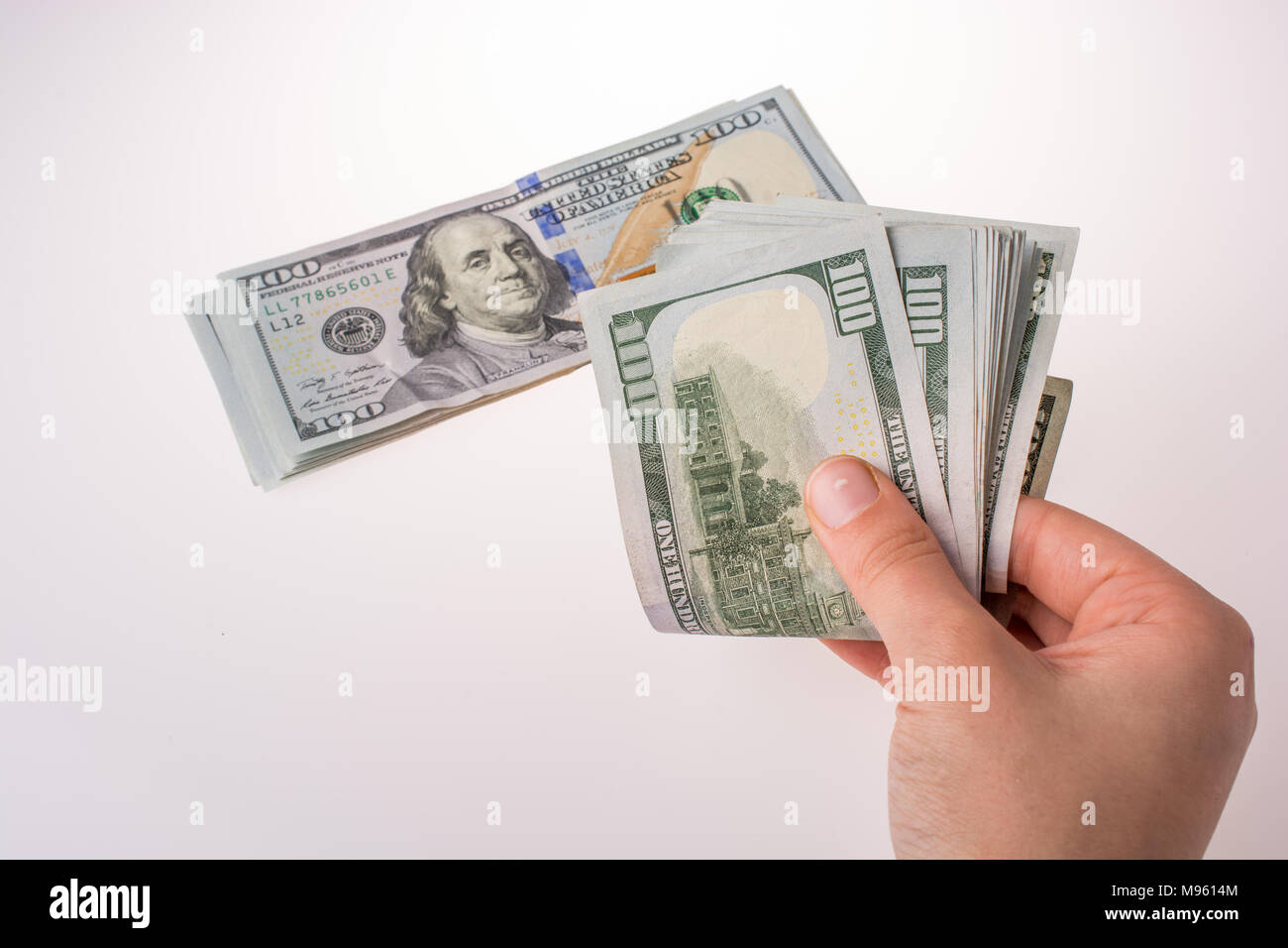 Human hand holding American dollar bill as money isolated on white ...