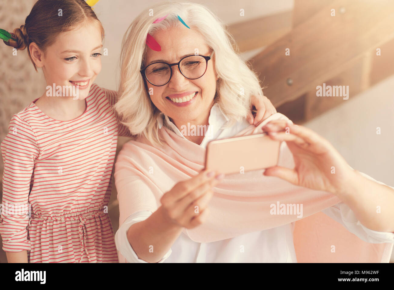 Woman taking family photo hi-res stock photography and images - Alamy