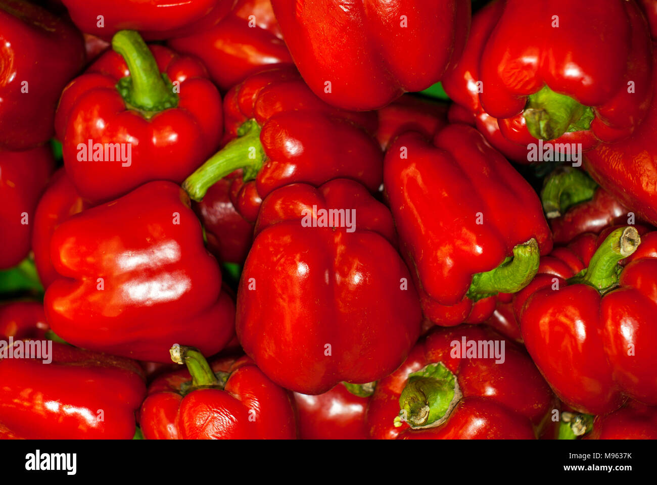 background - bright red ripe fruits of sweet capsicum bell pepper Stock ...