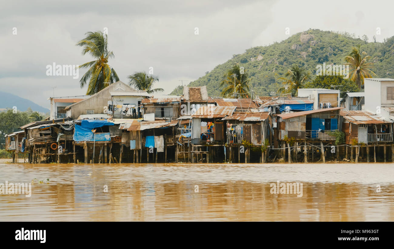 Slums in Nha Trang. Houses on the river. Vietnam Stock Photo - Alamy