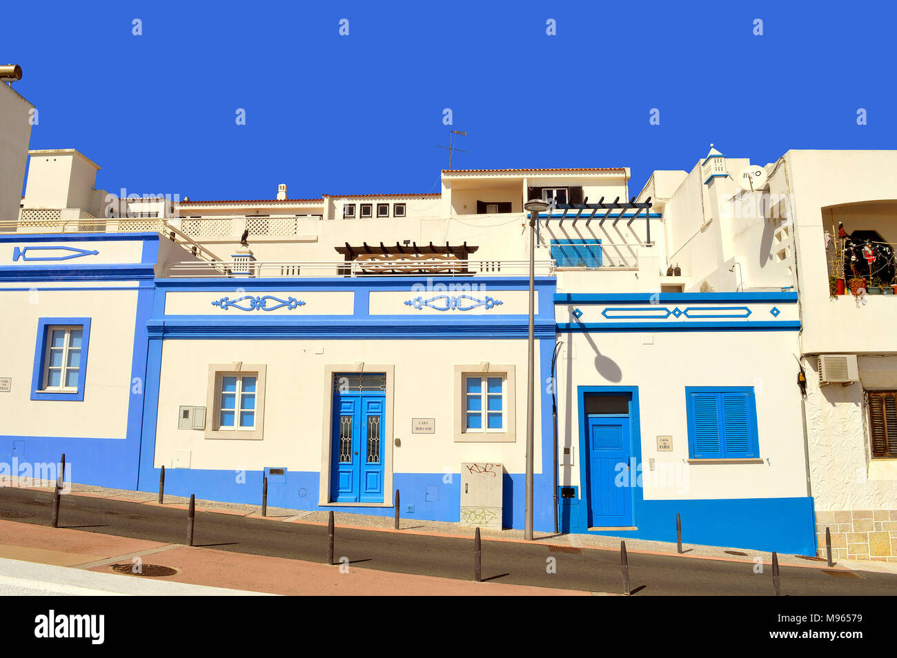 Blue and white houses built on a hill in Albufeira old town Stock Photo ...