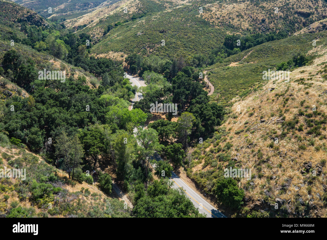 Asphalt road in the canyon bottom of southern California valley Stock ...
