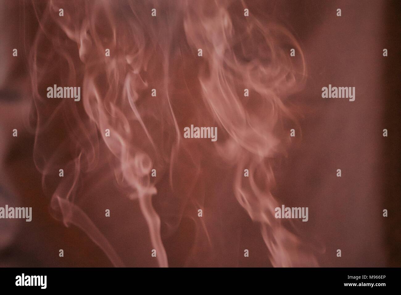Whirling puffs of incense smoke, mysterious Stock Photo - Alamy