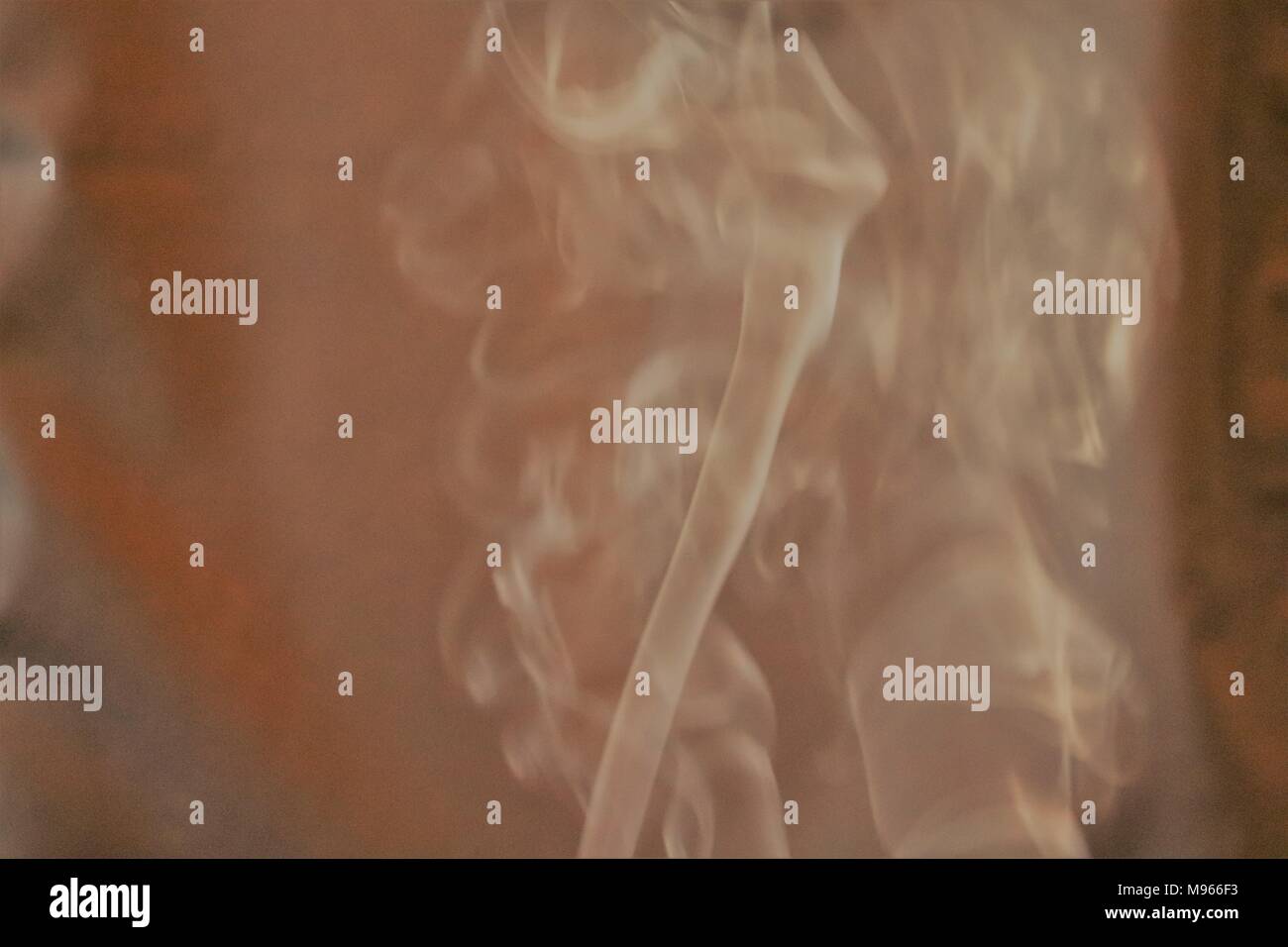 Whirling puffs of incense smoke, mysterious Stock Photo - Alamy