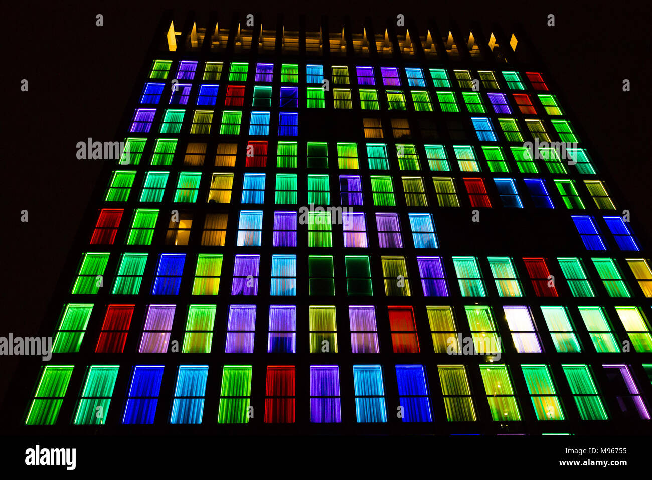 Colored windows texture. Windows illuminated by neon lights background ...