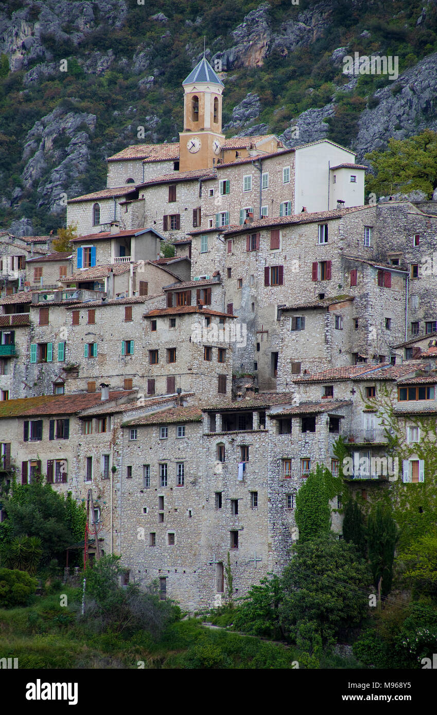 The fortified medieval village Peillon clings to a cliff face ...