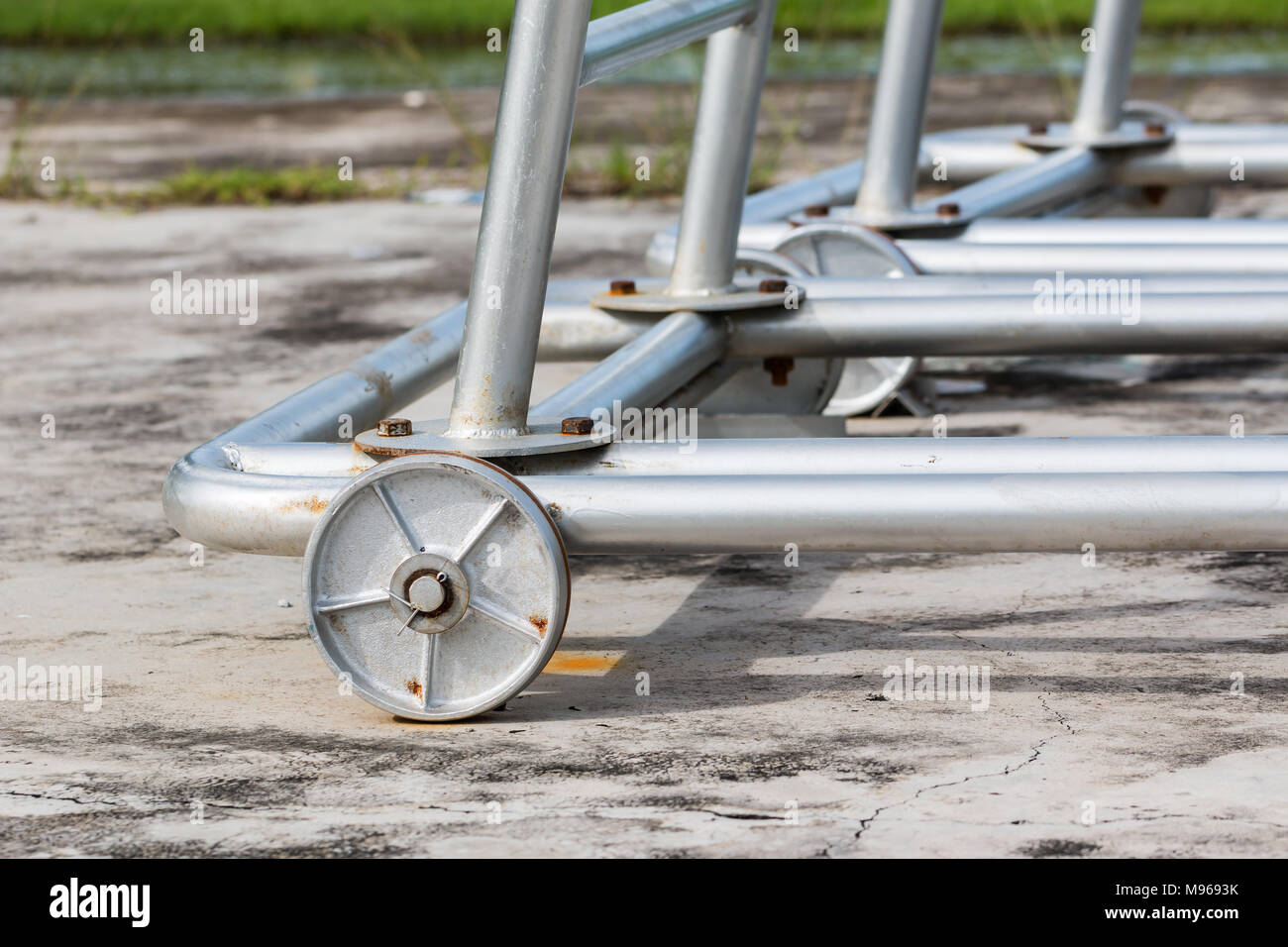 Rusty iron wheel base of iron structure Stock Photo - Alamy