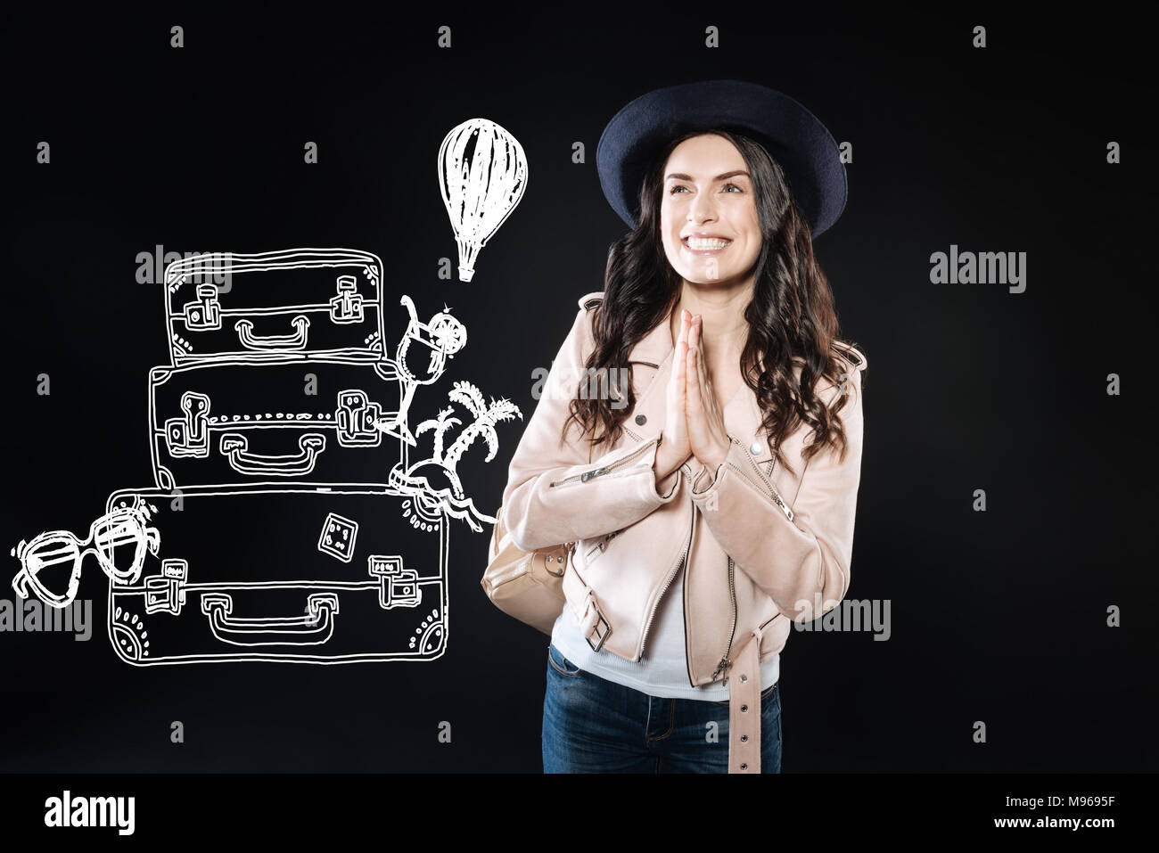 Optimistic person smiling and planning her holidays abroad Stock Photo ...