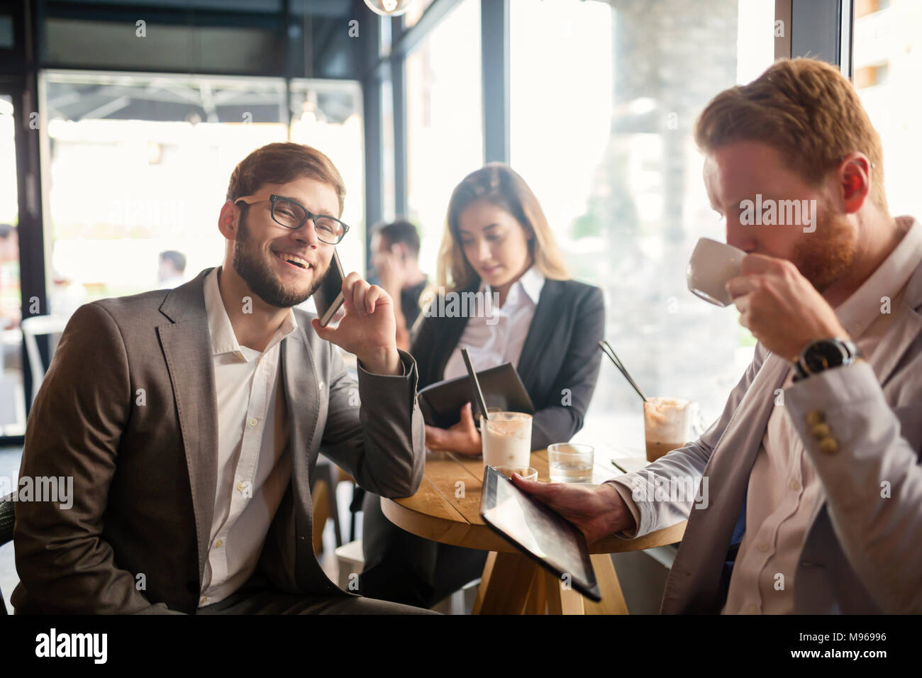 Business people talking and laughing together Stock Photo - Alamy