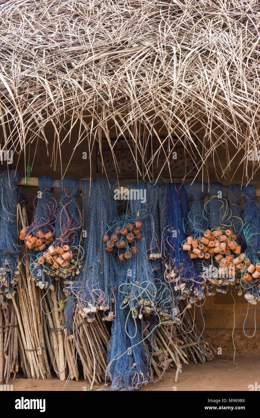 Fishing nets hanging on a traditional house with reed roof on Uzi ...
