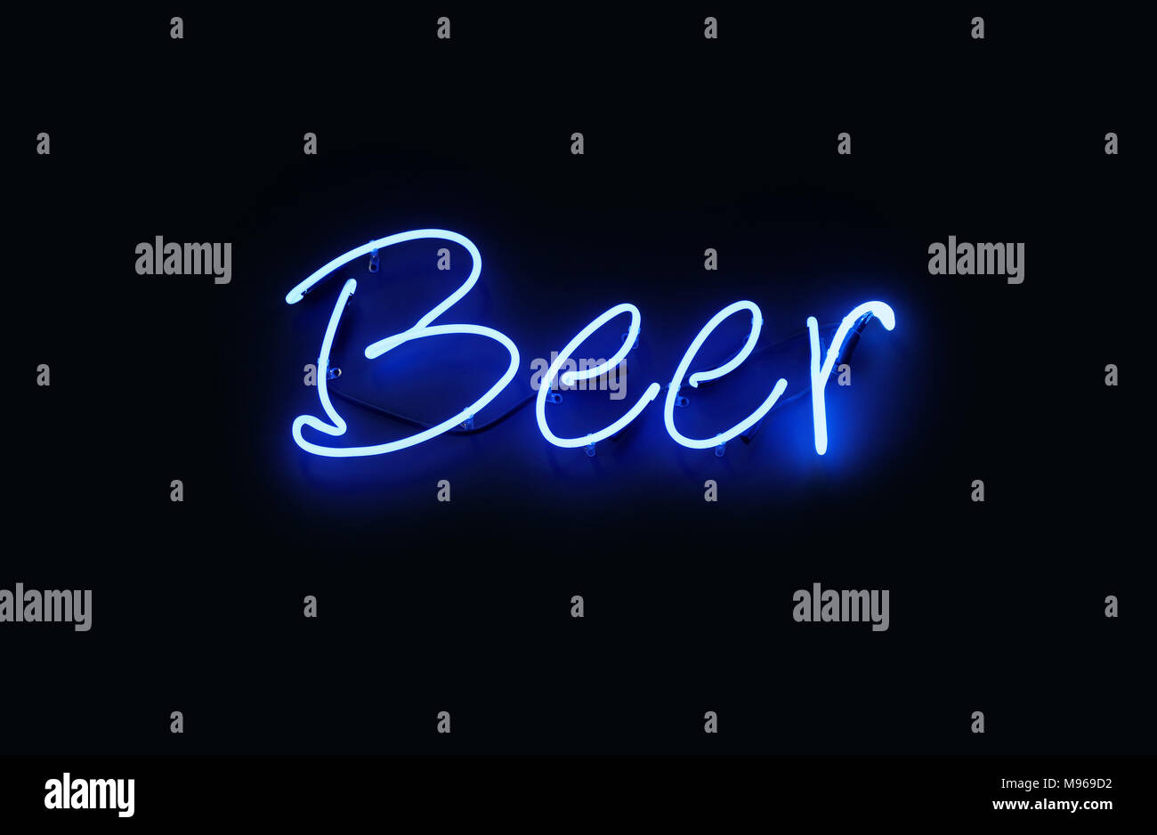 Close up BEER indigo blue neon light sign glowing in the dark over ...