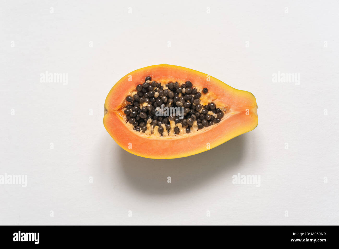 Half papaya on a white background. Exotic fruit, split view Stock Photo ...