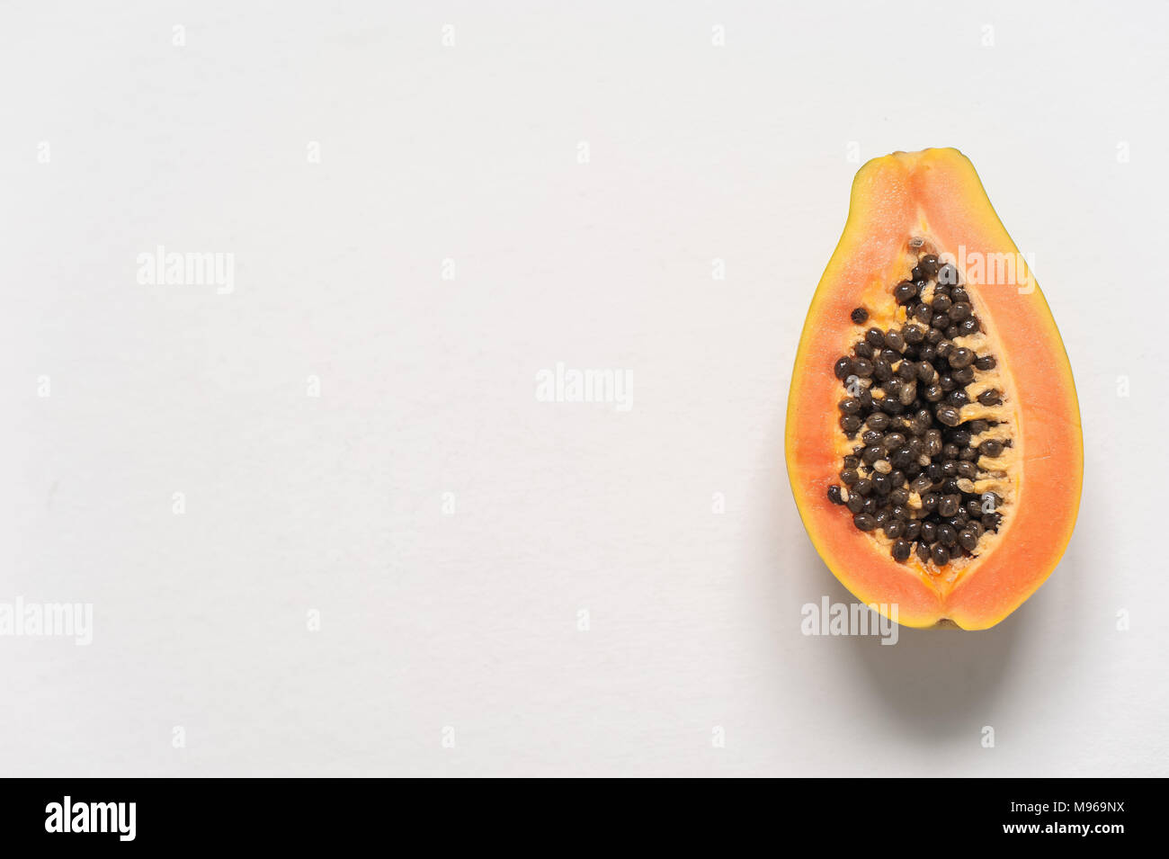 Half papaya on a white background. Exotic fruit, split view Stock Photo ...
