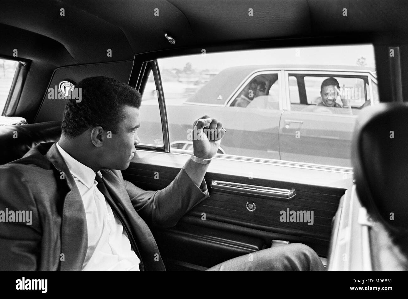 Muhammad Ali gestures to a driver in another car. 31st August 1967 ...