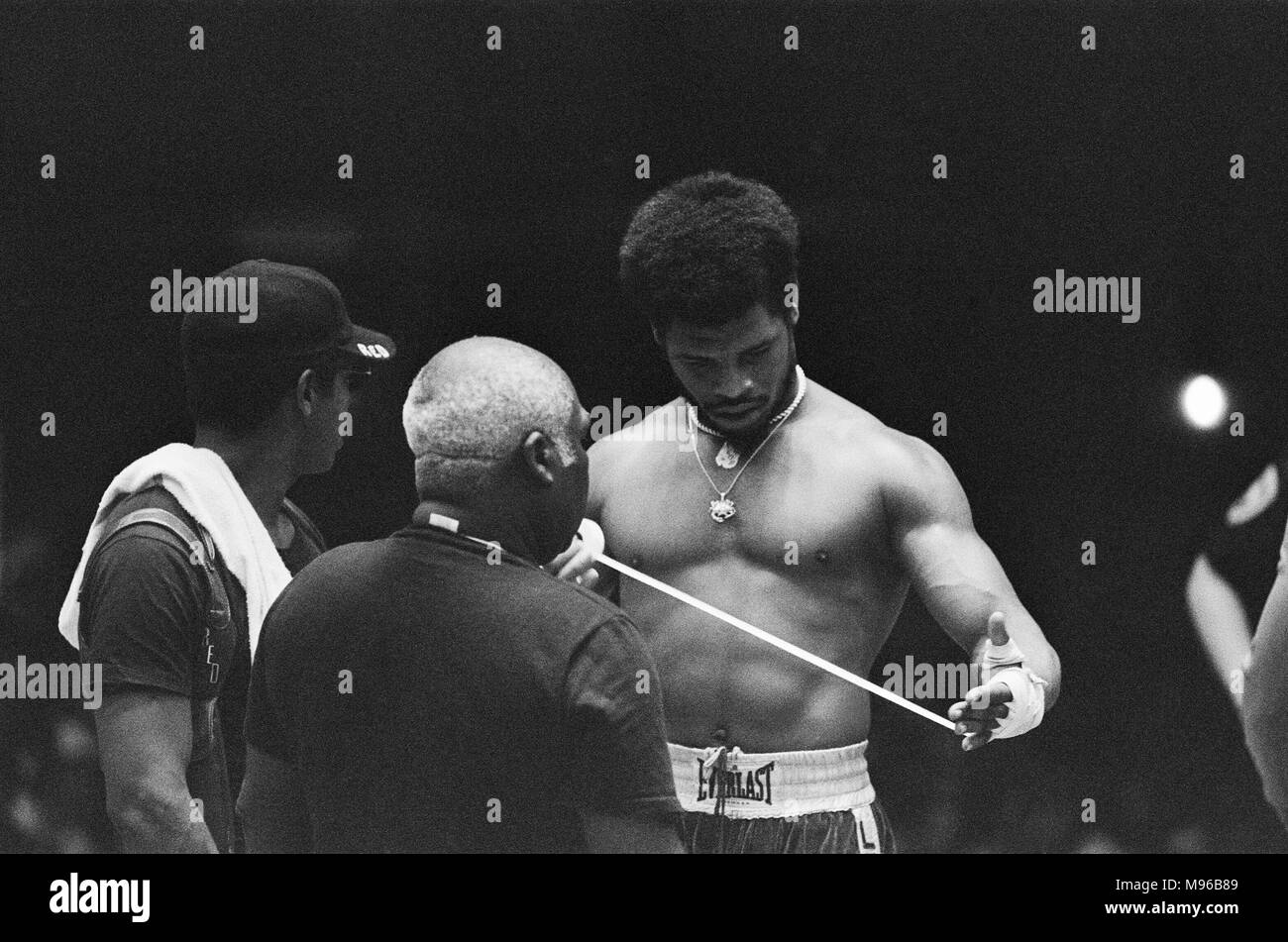 Leon Spinks (right) wrapping his hands in the gym ahead of his second ...