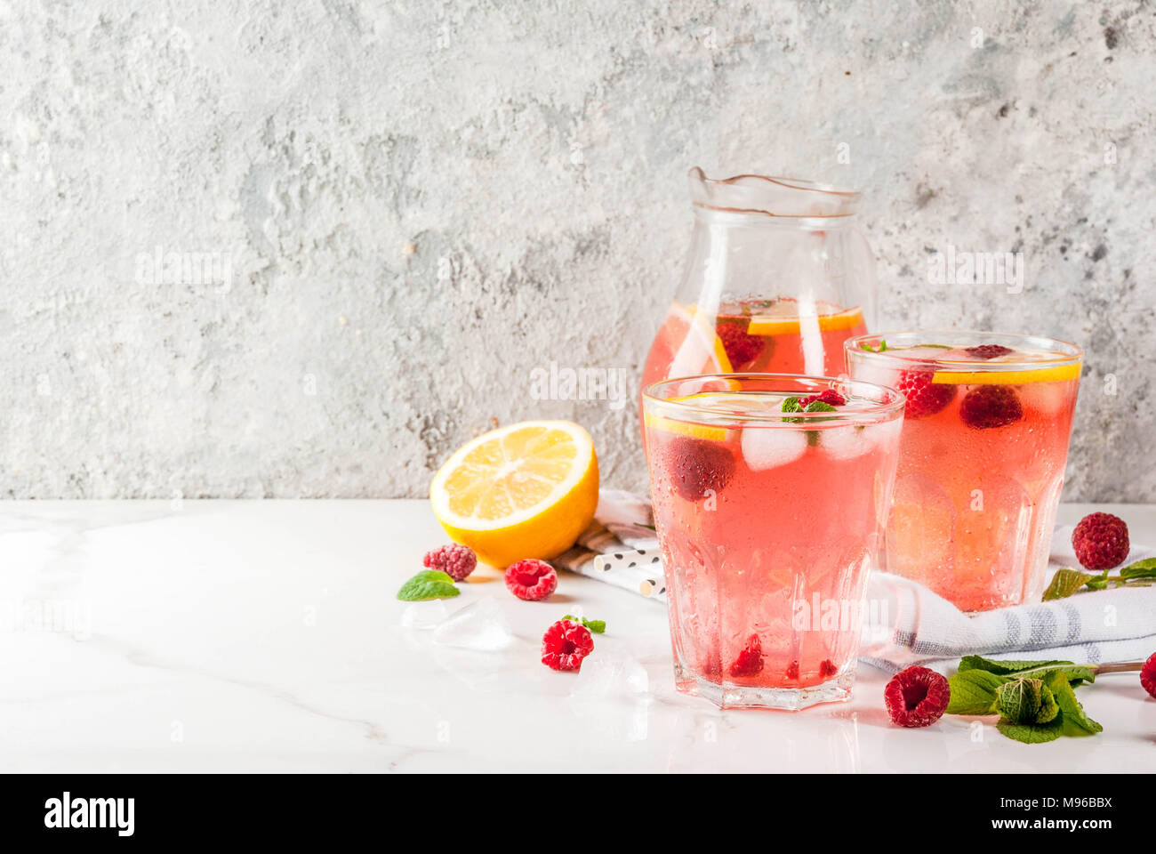 Summer refreshing drinks, fruit and berry raspberry mojito or lemonade ...