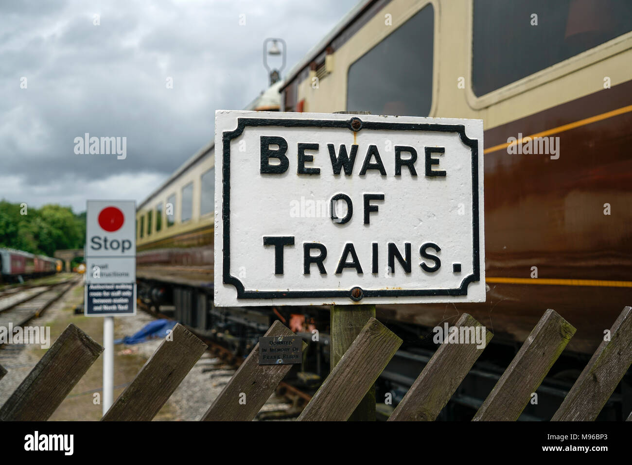 Beware of Trains sign on station Stock Photo - Alamy