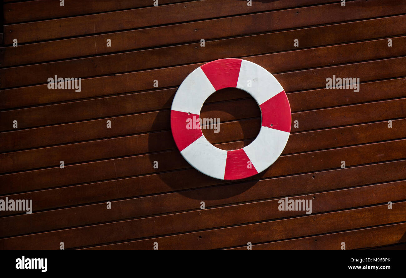 Life preserver or life saver hanging in air Stock Photo - Alamy