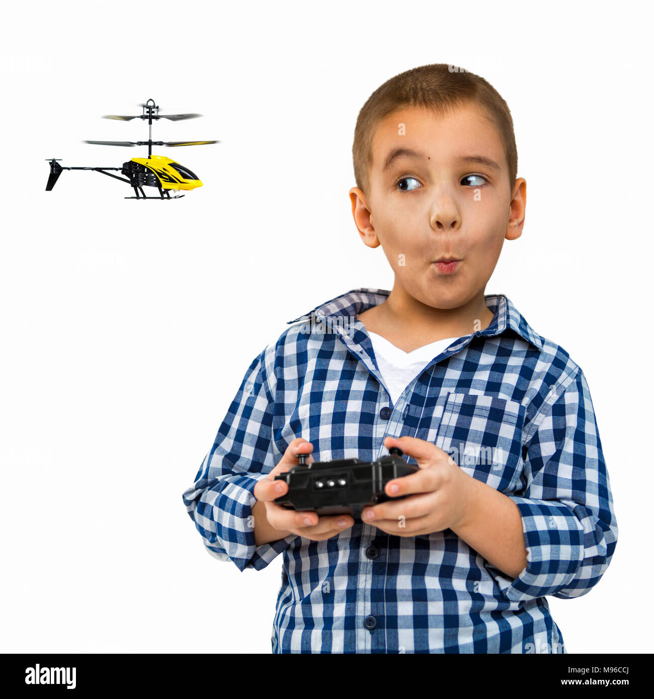 Portrait of a child with a toy. A little boy drives a helicopter. Photo ...