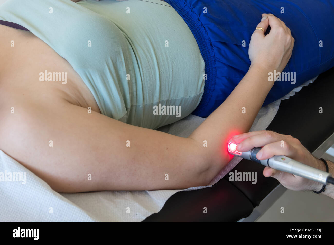 Laser therapy in hand used to treat pain. selective focus Stock Photo ...
